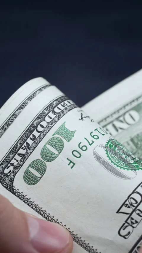 Vertical video of US currency - dollars ... | Stock Video | Pond5