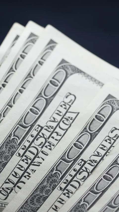 Vertical video of US currency - dollars ... | Stock Video | Pond5