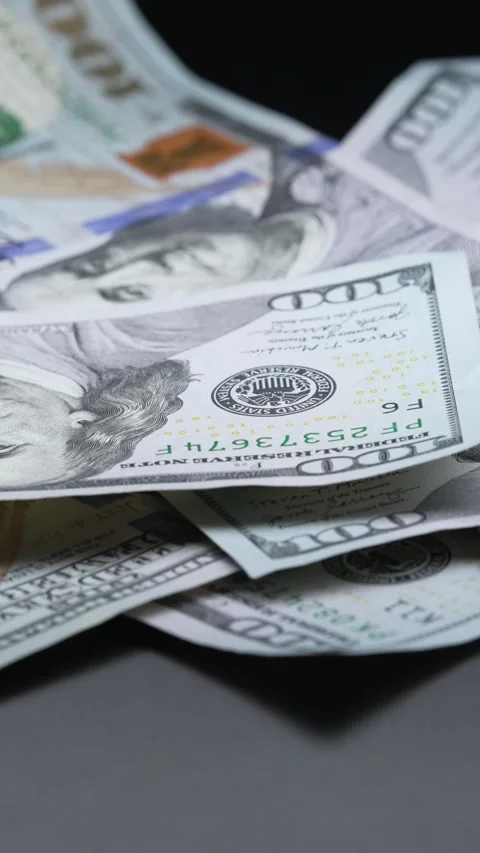 Vertical video of US currency - dollars ... | Stock Video | Pond5
