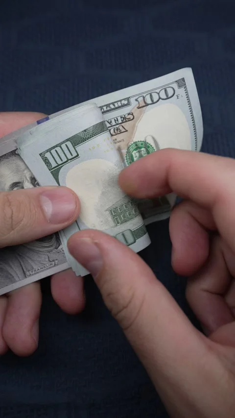 Vertical video of US currency - dollars ... | Stock Video | Pond5