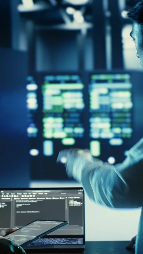 Vertical video Workers coding in data ce... | Stock Video | Pond5