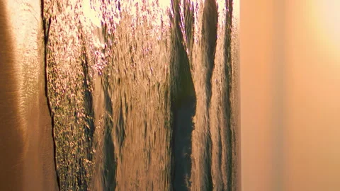 Vertically oriented beach sunrise foamy ... | Stock Video | Pond5