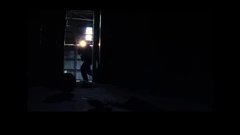 A very dark room with light coming from ... | Stock Video | Pond5