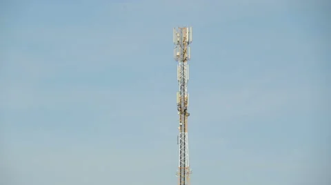 A very tall cellular tower on the city | Stock Video | Pond5