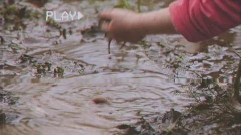 VHS Mud pond play detail rock | Stock Video | Pond5