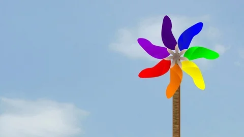 VIBGYOR Coloured Spinning Pin wheel agai... | Stock Video | Pond5
