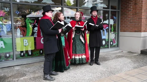 Victorian Christmas carolers singing out... | Stock Video | Pond5