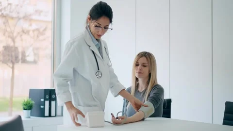 Video of beautiful female doctor measuri... | Stock Video | Pond5