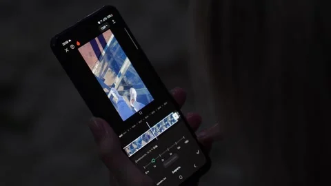 Video editor software on your phone. Gir... | Stock Video | Pond5