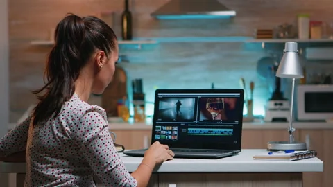 Video editor working from home at night | Stock Video | Pond5