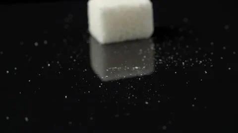 Video of falling white sugar cube on bla... | Stock Video | Pond5