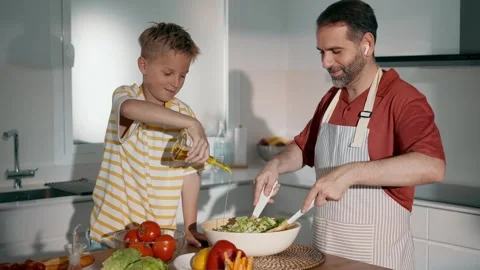 Video of handsome father cooking healthy... | Stock Video | Pond5