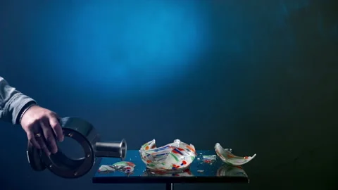 Video of man breaking glass vase on dark... | Stock Video | Pond5