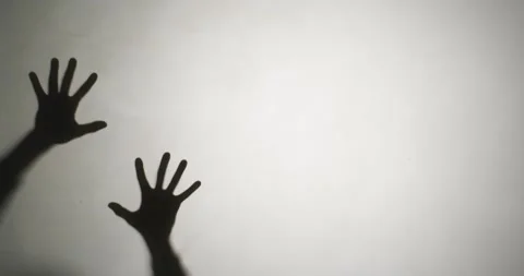 Video of silhouettes of hands moving on ... | Stock Video | Pond5