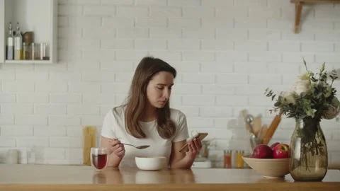 Video of a woman eating oatmeal for brea... | Stock Video | Pond5