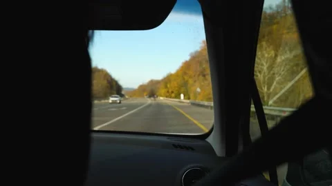 View from the back seat of the car on a ... | Stock Video | Pond5