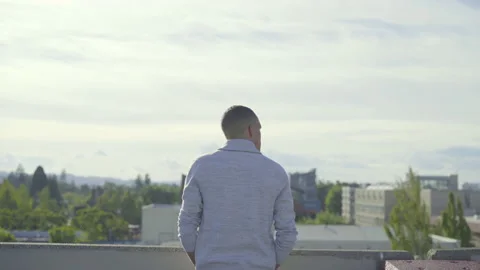 View From Behind of a Man Standing on a ... | Stock Video | Pond5