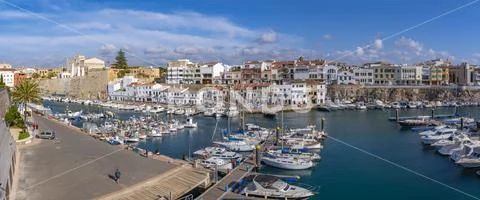 Photograph: View of boats in marina and whitewashed houses from ...