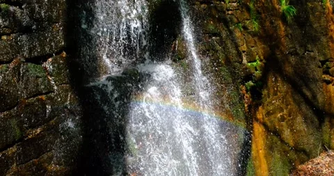 view of cascade stream with rainbow refl... | Stock Video | Pond5