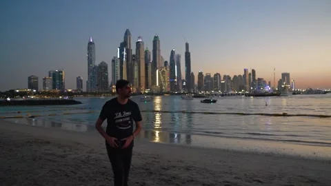 View of handsome boy and Dubai beach and... | Stock Video | Pond5