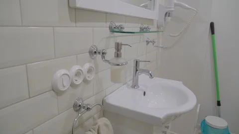 The view inside the bathroom sink area i... | Stock Video | Pond5