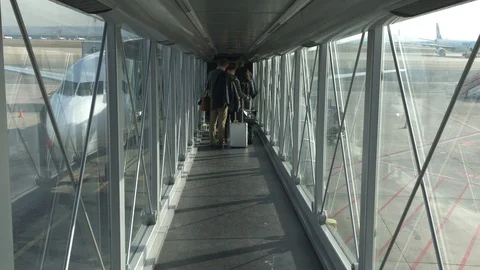 View inside a jet bridge of people board... | Stock Video | Pond5