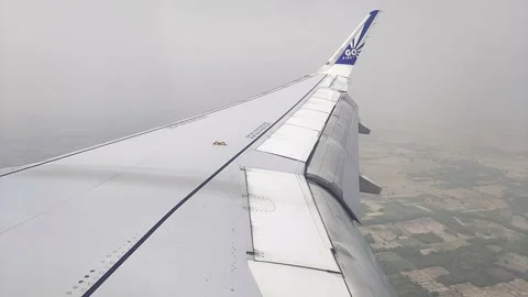 View of jet plane wing with cloud patter... | Stock Video | Pond5