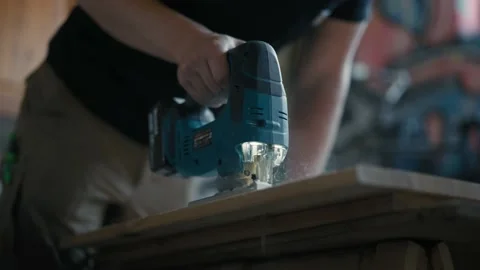View of the man working with jigsaw and ... | Stock Video | Pond5