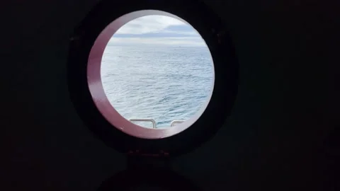 View of the ocean through a porthole fro... | Stock Video | Pond5