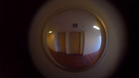 View from the peephole in the door in 4k... | Stock Video | Pond5