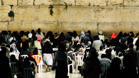 view of people praying front the wailing... | Stock Video | Pond5