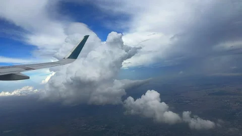 View from plane window. Flying through c... | Stock Video | Pond5