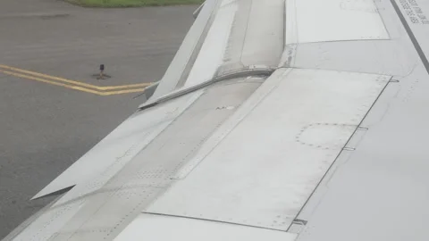 view to rear wing of a airplane with fla... | Stock Video | Pond5