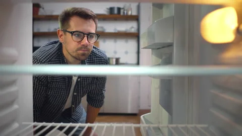View from refrigerator. Young man openin... | Stock Video | Pond5