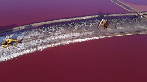View of a salt tower between two pink sa... | Stock Video | Pond5