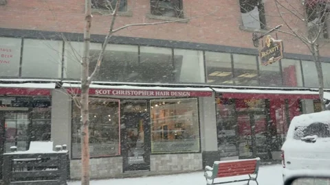 View of storefronts during a snow storm ... | Stock Video | Pond5