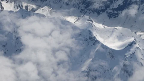 View from the stratosphere of snow peaks... | Stock Video | Pond5