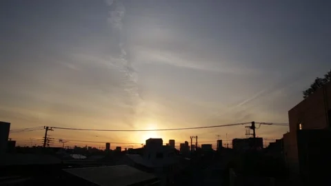 A view of the sunrise in Tokyo. Early mo... | Stock Video | Pond5