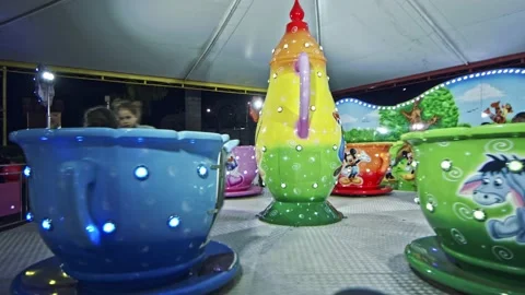 View of tea cups carousel at Nicolandia ... | Stock Video | Pond5