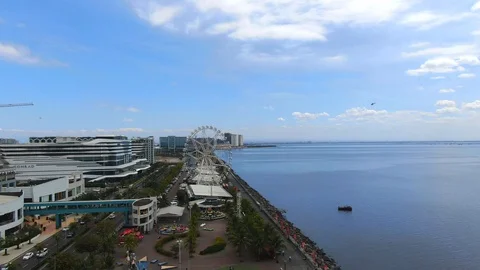 A view of a theme park by the bay in pas... | Stock Video | Pond5