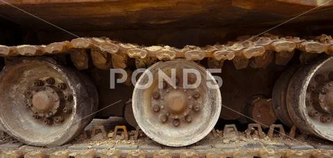 Photograph: View of the wheels of a rusty howitzer. Rusty military ...
