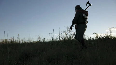 Viking Walking Dramatically with an Axe ... | Stock Video | Pond5