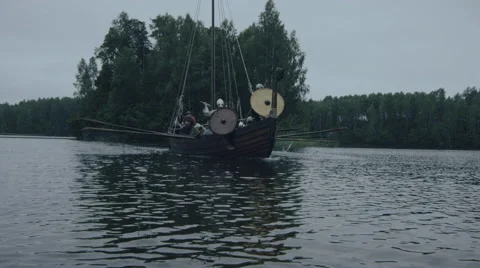 Viking Warriors on a Row Ship Arrive to ... | Stock Video | Pond5