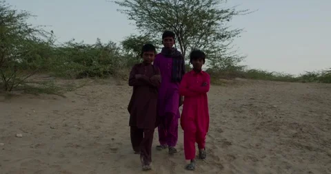 Villagers kids walking on sand towards t... | Stock Video | Pond5