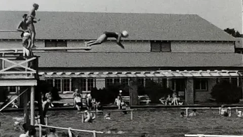 Vintage 1940s Diving into swimming pool.... | Stock Video | Pond5