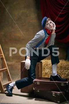 Vintage portrait of male mime artist expressing sadness and loneliness ...