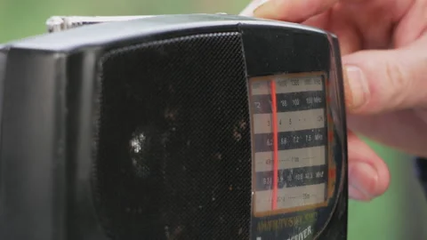 A vintage radio is tuned by turning a di... | Stock Video | Pond5