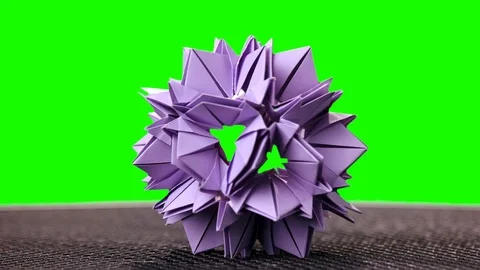 Violet origami flower on green screen. | Stock Video | Pond5