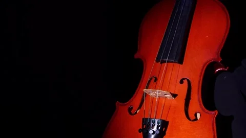 Violin, light appearing and revealing a ... | Stock Video | Pond5