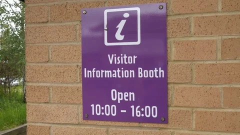 Visitor Information Booth Sign on brick ... | Stock Video | Pond5